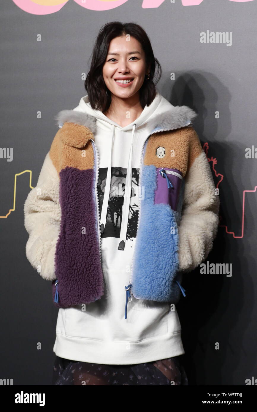 Chinese model Liu Wen poses as she arrives for the "Coach Lights Up ...