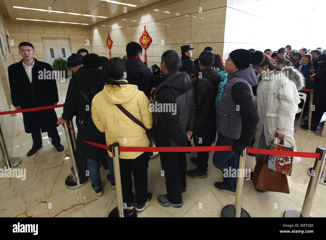 Chinese customers queue up outside the headquarters of the bike-sharing service ofo to demand an ...