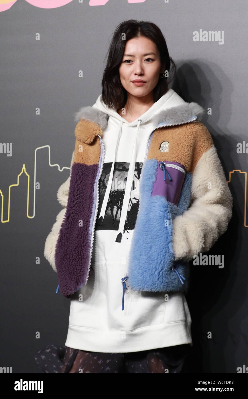 Chinese model Liu Wen poses as she arrives for the "Coach Lights Up ...