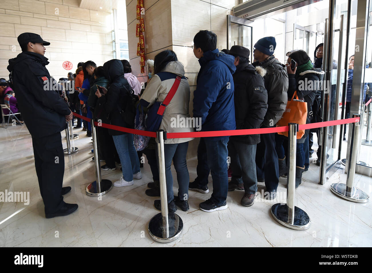 Chinese customers queue up outside the headquarters of the bike-sharing service ofo to demand an ...