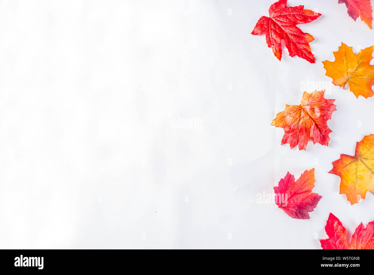Simple autumn red yellow orange leaves pattern, flatlay top view Stock Photo - Alamy