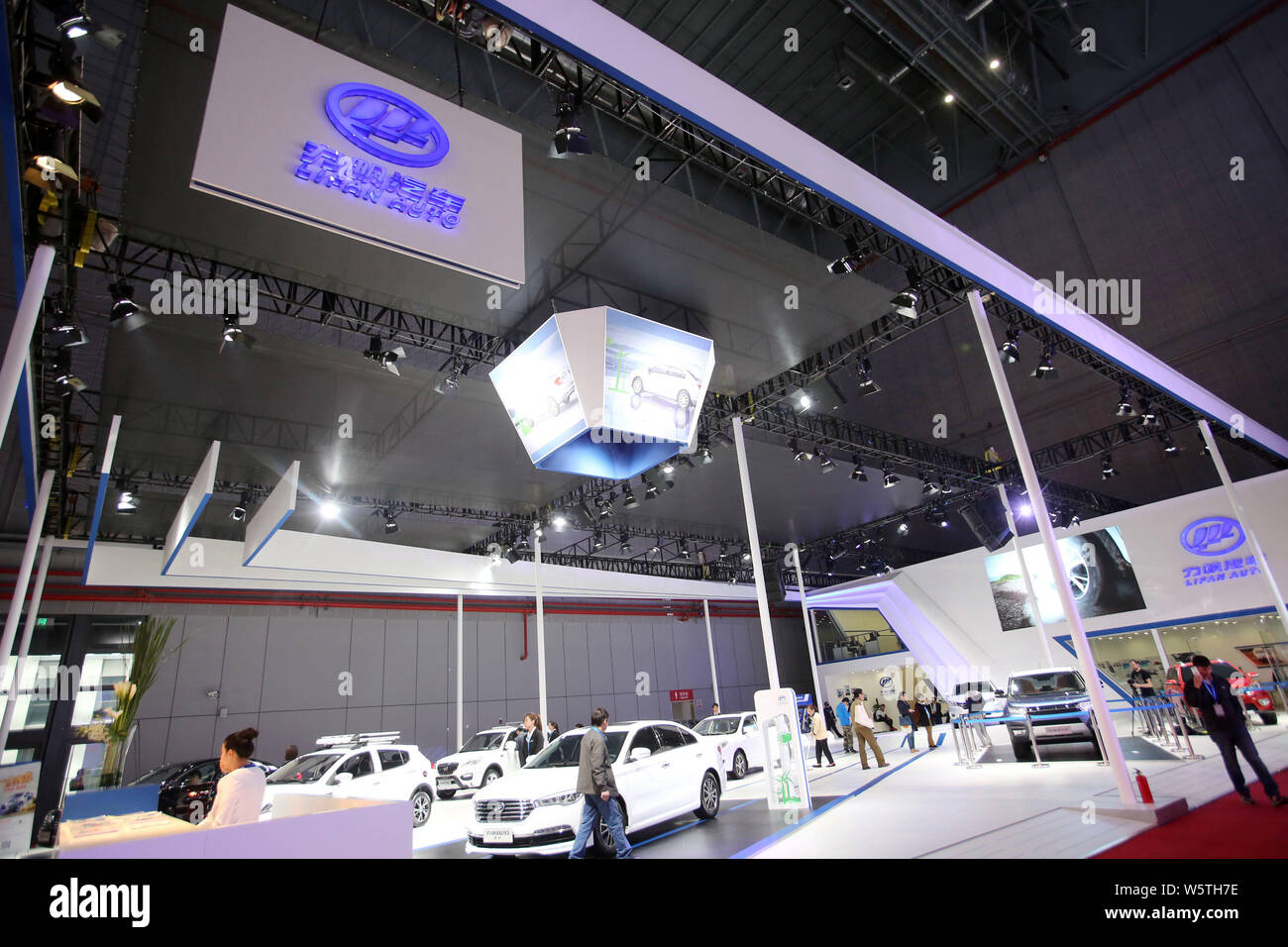 --FILE--People visit the stand of Chinese vehicle producer Lifan ...