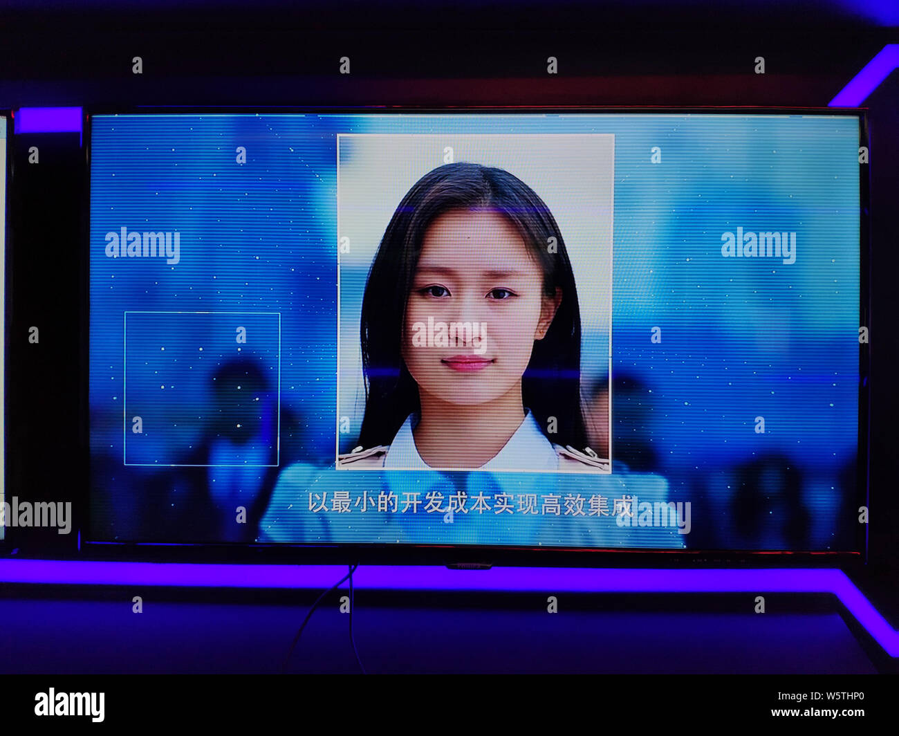 A visitor tries out the face recognition technology at the stand of Baidu during the ELEXCON ...