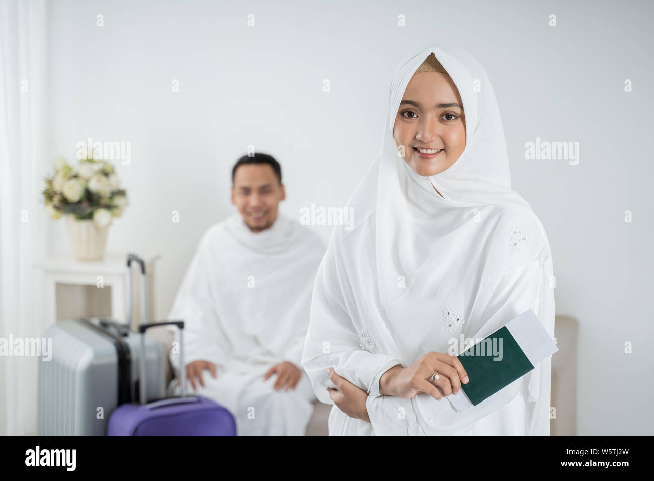 young woman wearing white traditional clothes for Ihram ready for Hajj ...