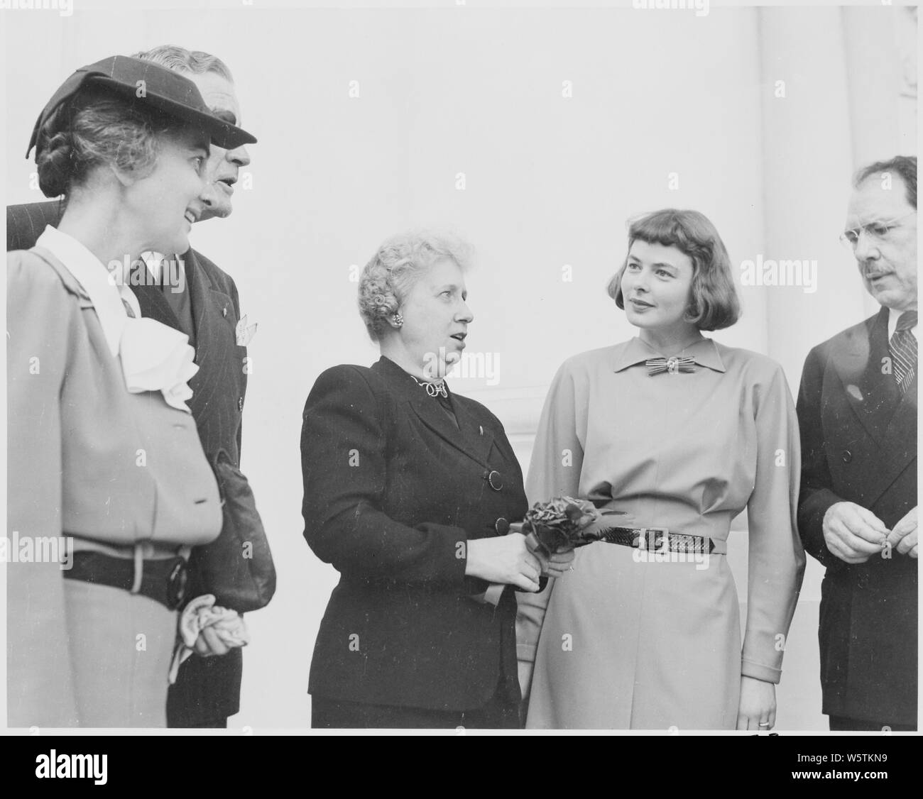 Photograph of First Lady Bess Truman at the White House, receiving a ...