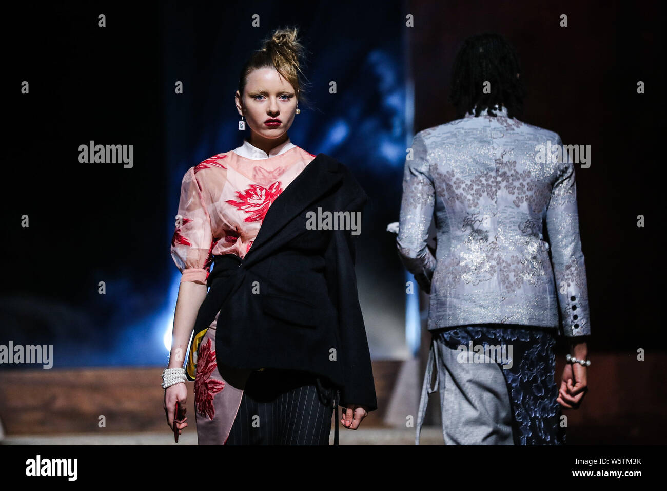 A model displays a new creation during the OPPO Fantasy New Year Big ...