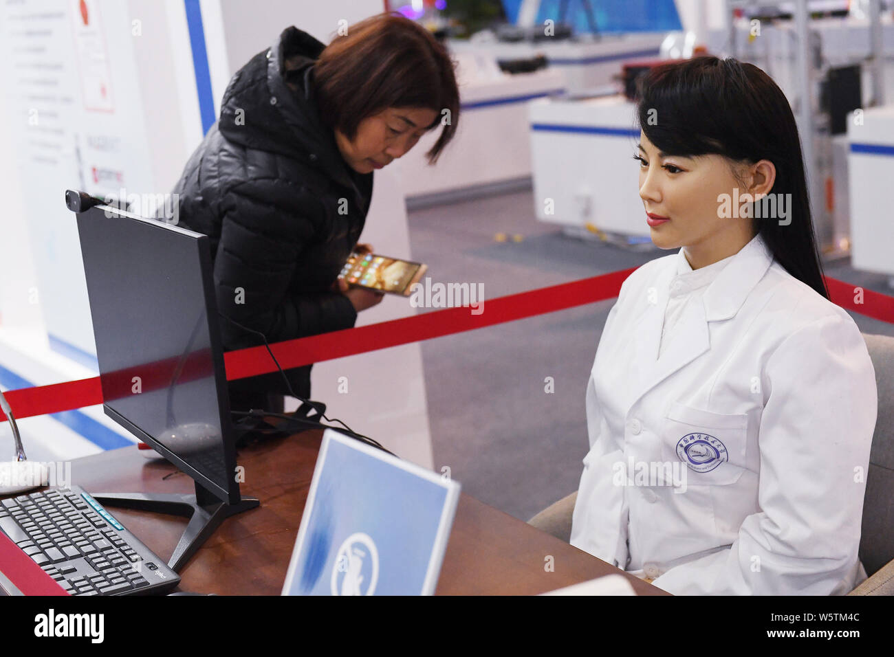 A robot called Yi Jia is on display at a tech exhibition marking 40 years of China's reform and ...