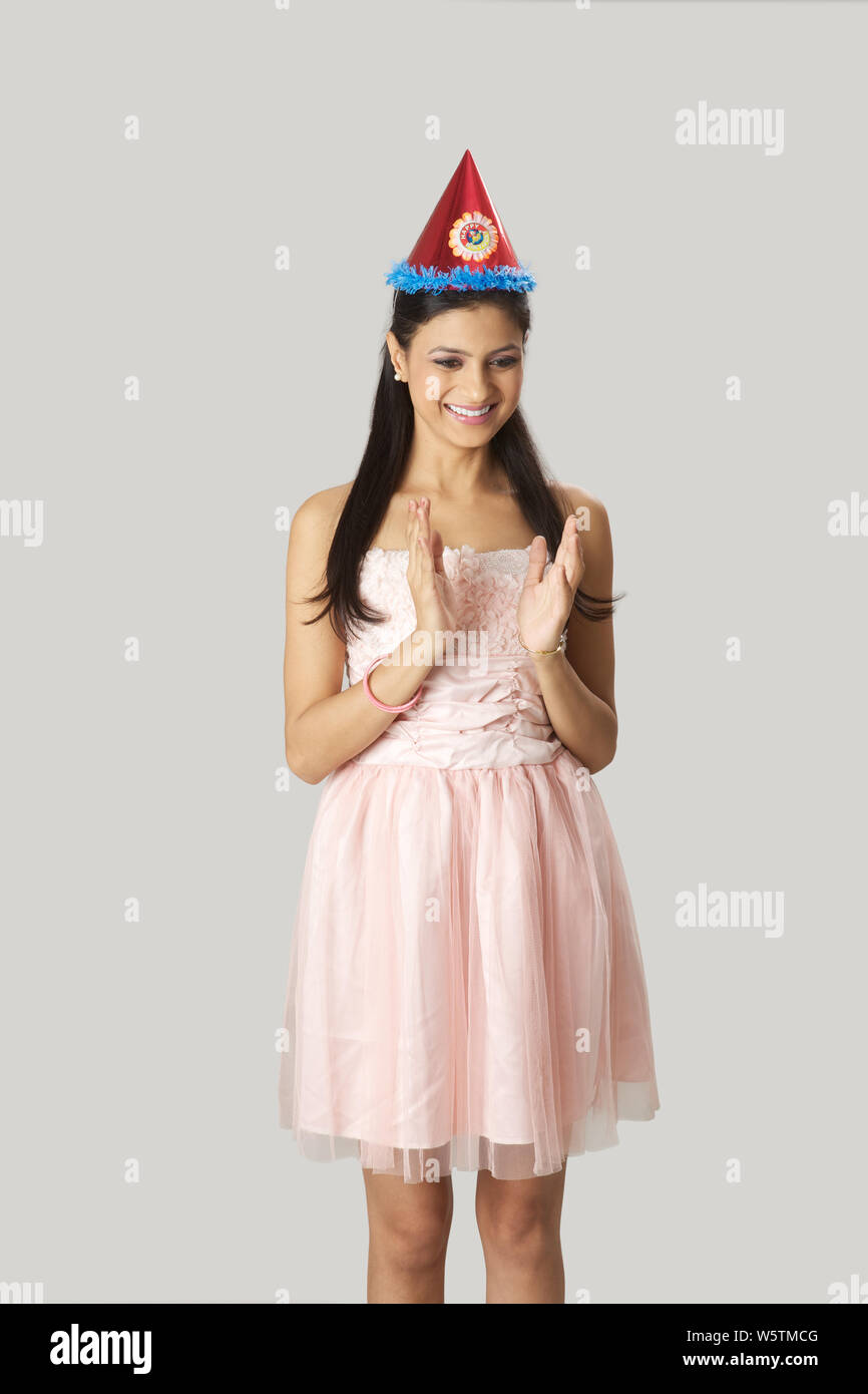 Indian young woman clapping in birthday party Stock Photo - Alamy
