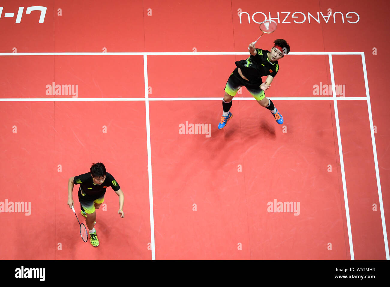 Du Yue and Li Yinhui of China return a shot to Misaki Matsutomo and ...