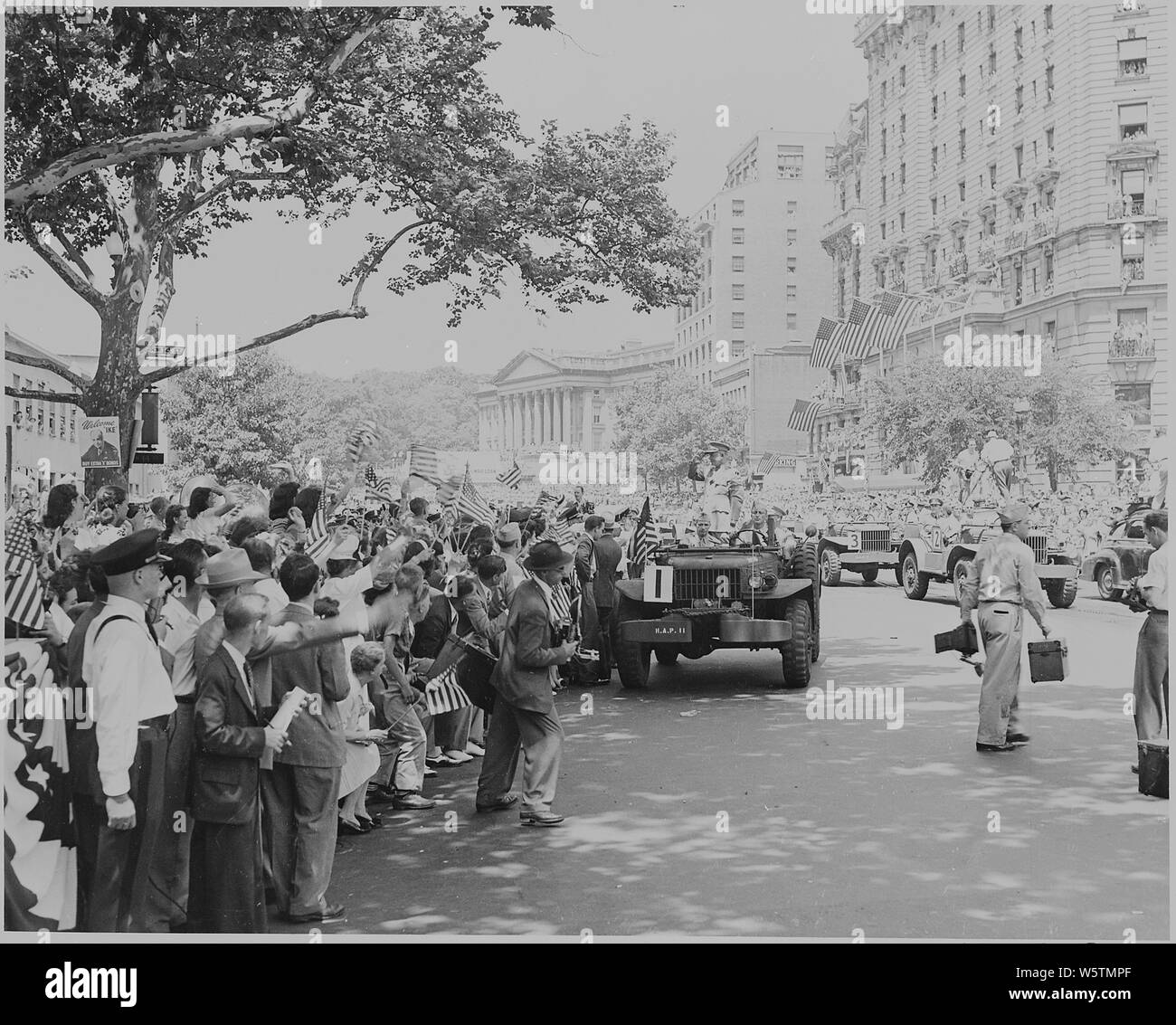 Photograph of General Dwight D. Eisenhower standing up in the back of ...
