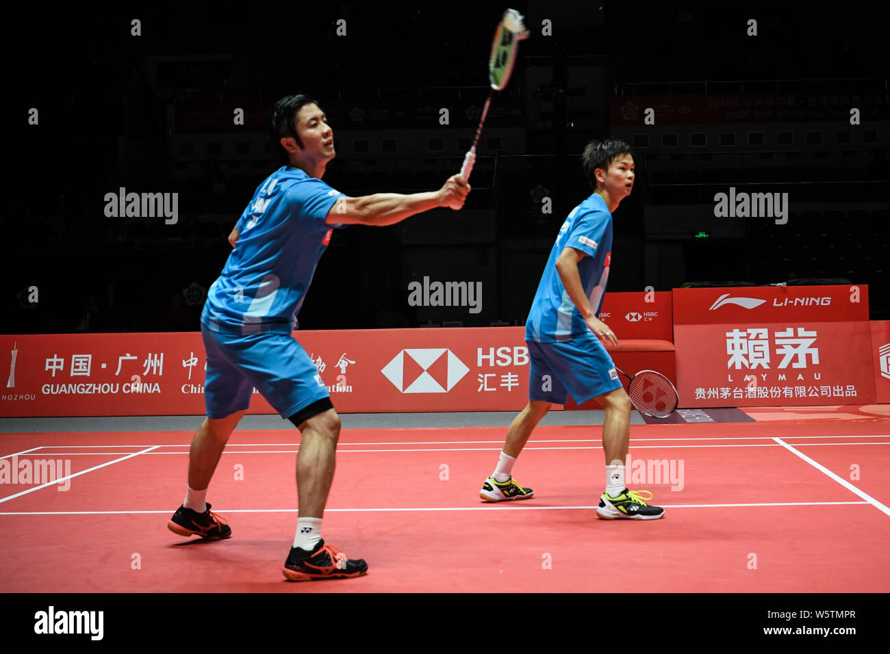 Hiroyuki Endo and Yuta Watanabe of Japan return a shot to Chen Hung ...