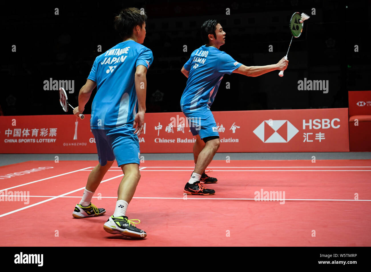 Hiroyuki Endo and Yuta Watanabe of Japan return a shot to Chen Hung-ling and Wang Chi-lin of ...