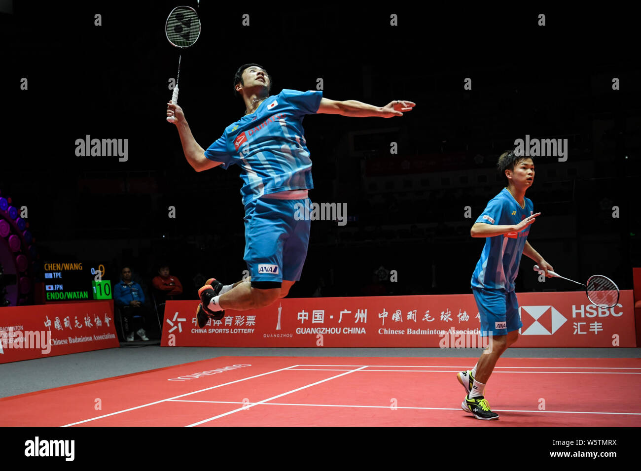 Hiroyuki Endo and Yuta Watanabe of Japan return a shot to Chen Hung-ling and Wang Chi-lin of ...