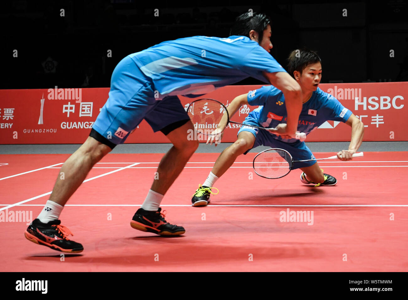 Hiroyuki Endo and Yuta Watanabe of Japan return a shot to Chen Hung-ling and Wang Chi-lin of ...