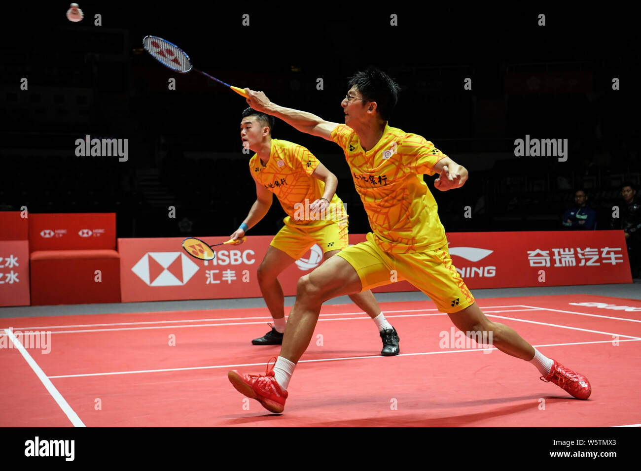 Chen Hung-ling and Wang Chi-lin of Chinese Taipei return a shot to Hiroyuki Endo and Yuta ...