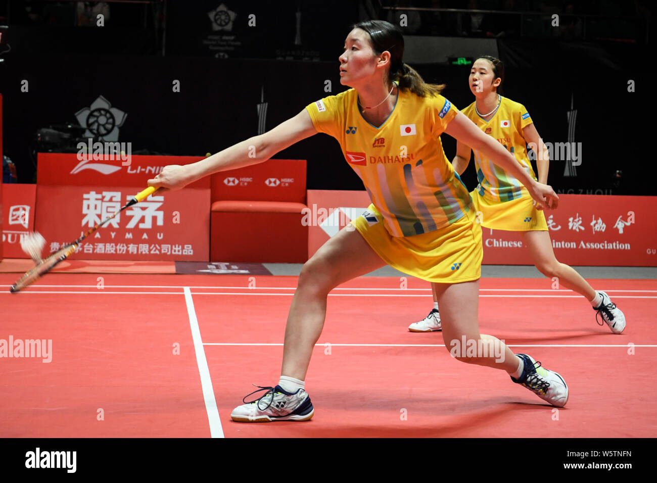 Mayu Matsumoto and Wakana Nagahra of Japan return a shot to Gabriela ...