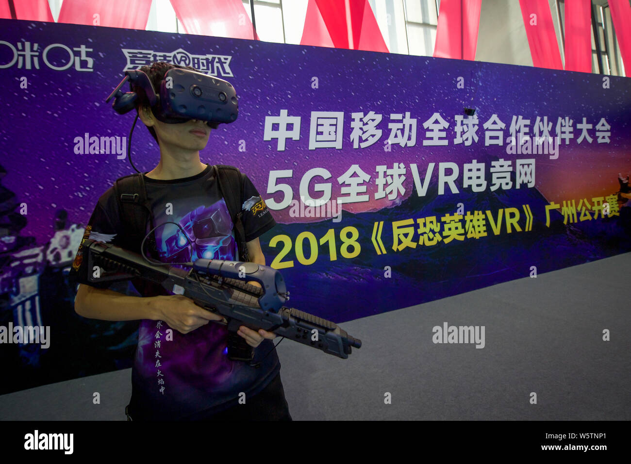 A visitor tries out the 5G VR video game "Hero and the Terror" during ...