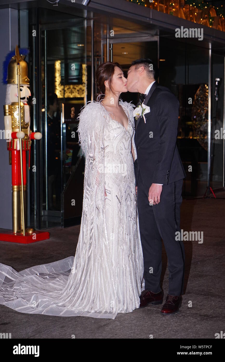 Hong Kong singer and actress Gillian Chung of pop duo Twins kisses her ...