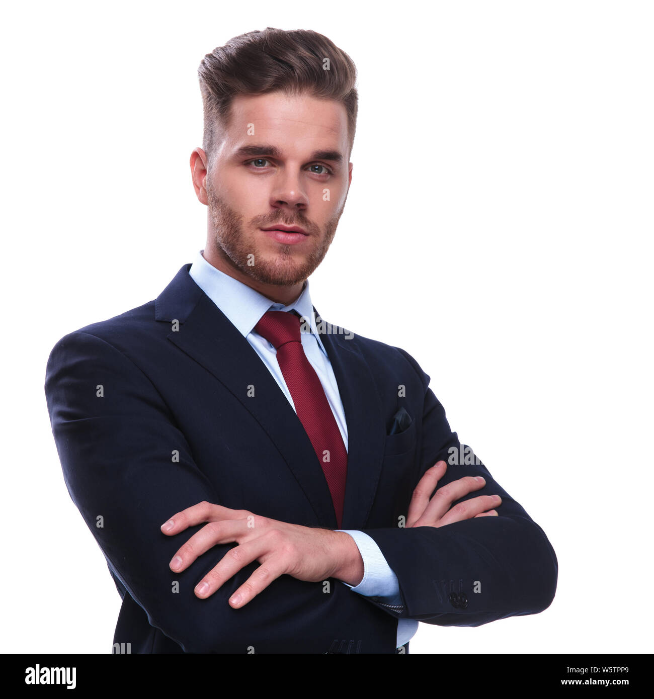 portrait of attractive young businessman standing on white background ...