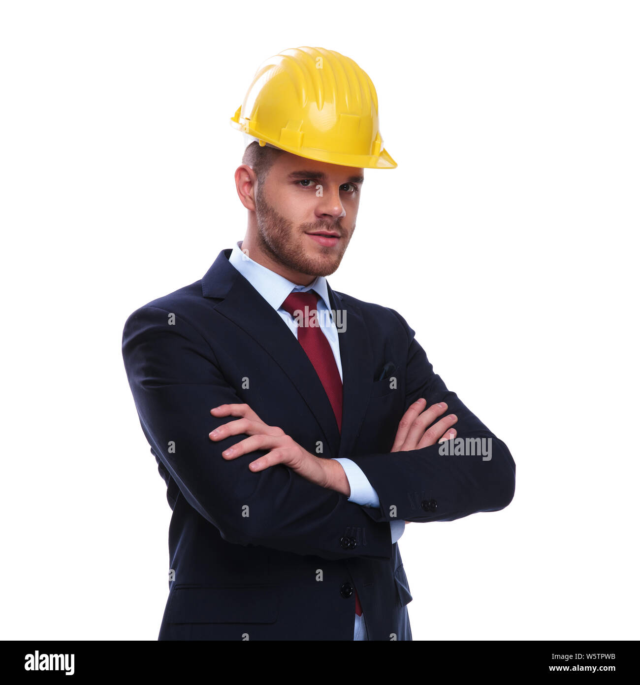 portrait of confident businessman wearing an engineer helmet while ...