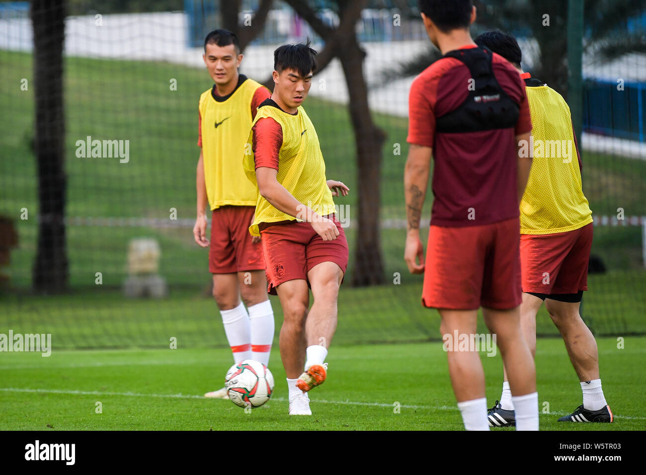 Members of the Chinese national men's football team take part in a ...