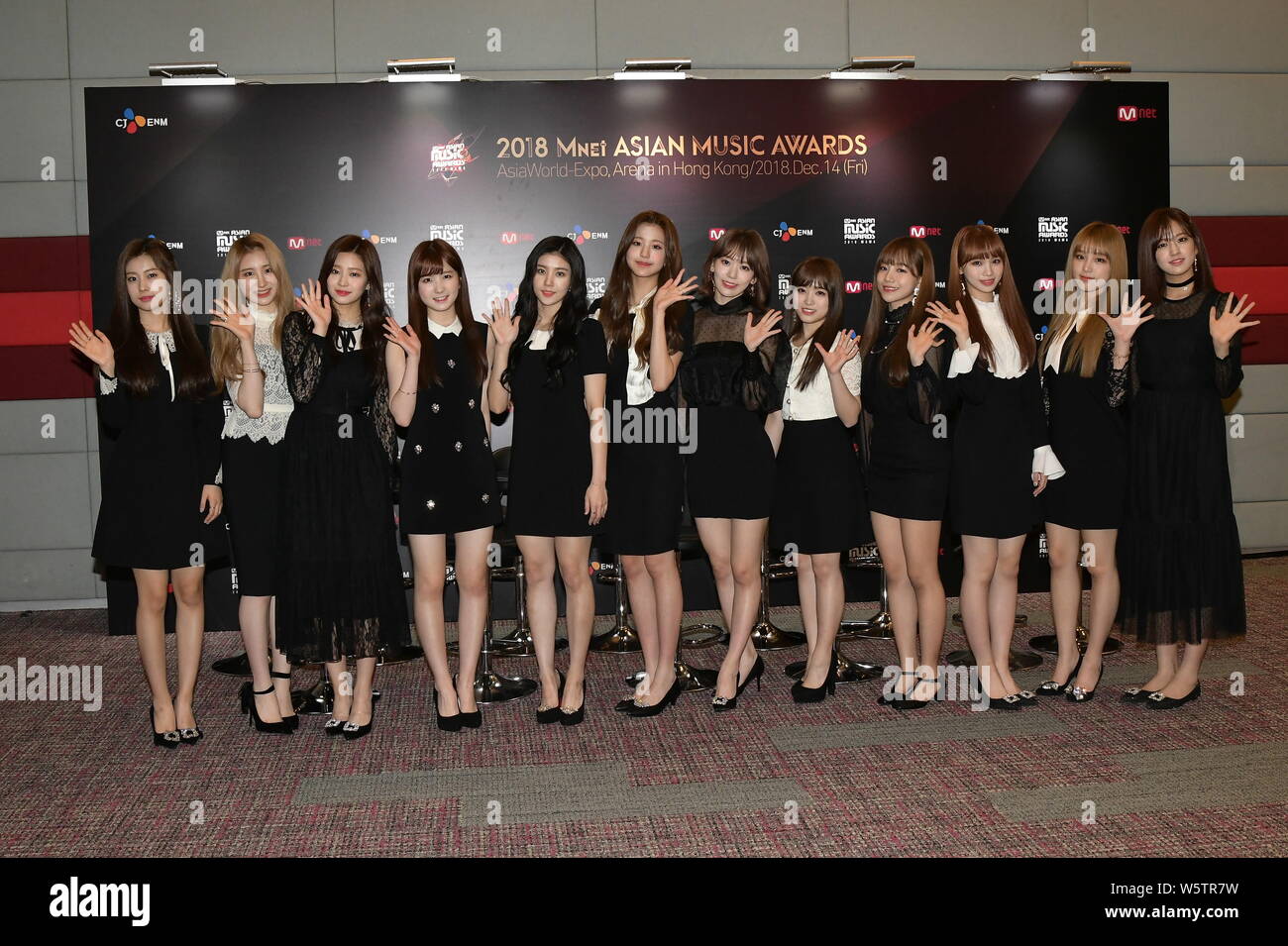 Members of South Korean girl group Izone, stylized as IZ*ONE, pose ...