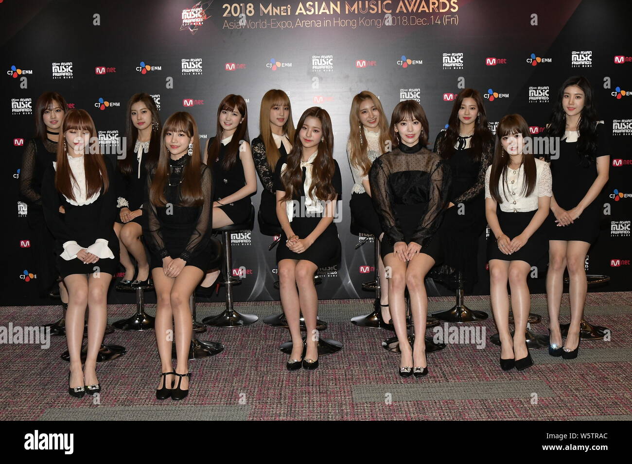 Members of South Korean girl group Izone, stylized as IZ*ONE, pose ...