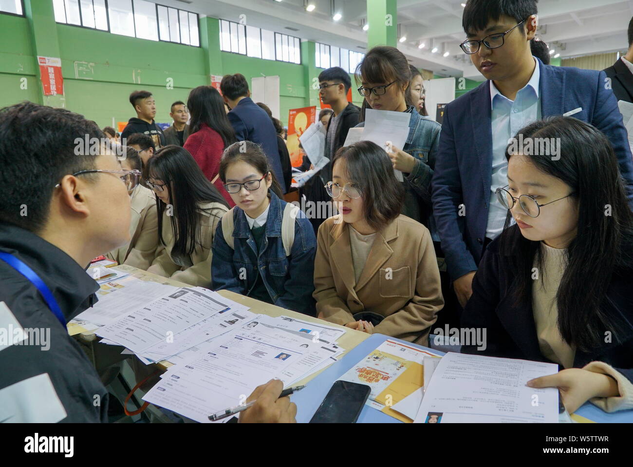 --FILE--Chinese job seekers look for employment at a job fair in ...