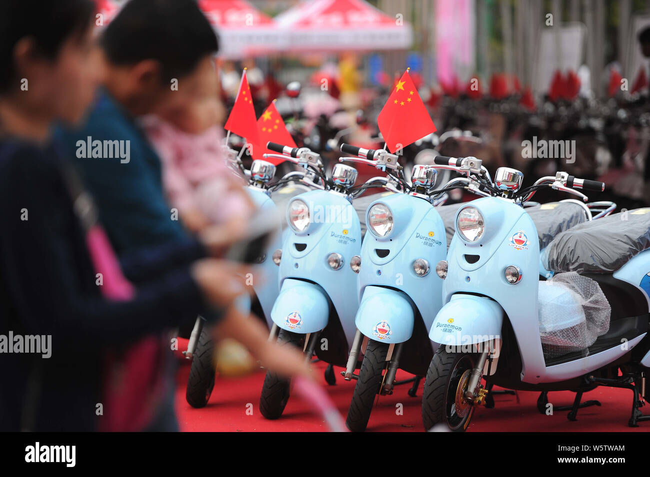 --FILE--Electric bikes and scooters to be exported are on display ...