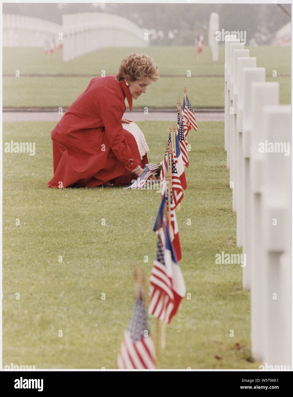 Photograph of Mrs. Reagan laying flowers at the Omaha Beach Memorial ...
