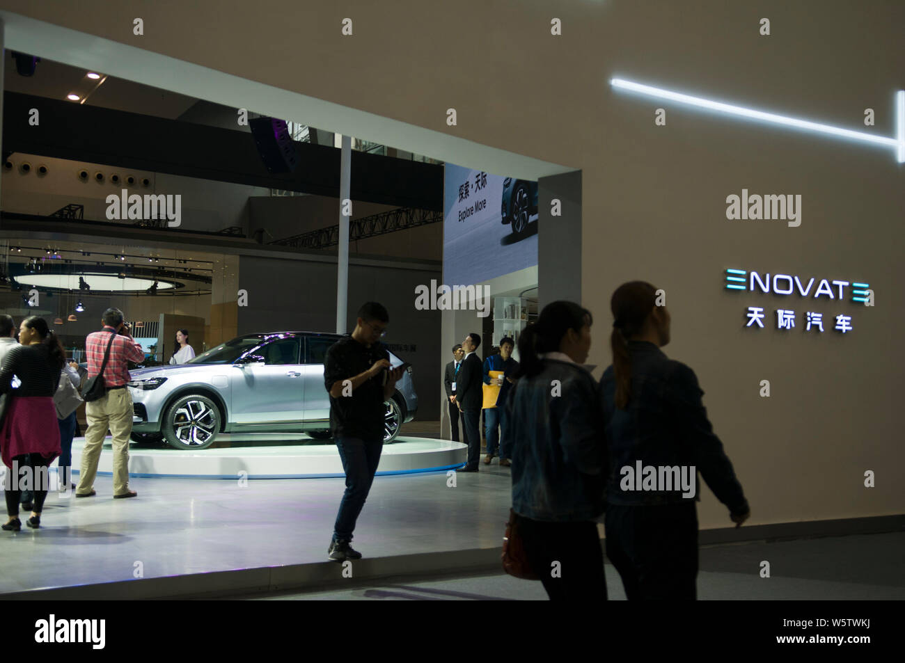 --FILE--People visit the stand of Enovate, a high-end brand of Chinese ...