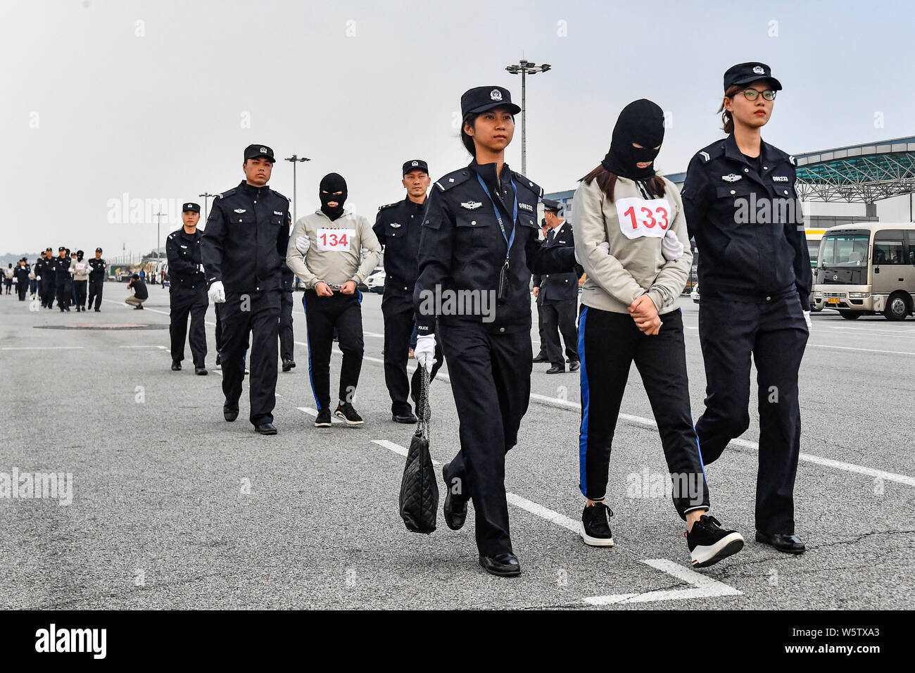 Chinese suspects arrested for cross-border telecom fraud are escorted ...