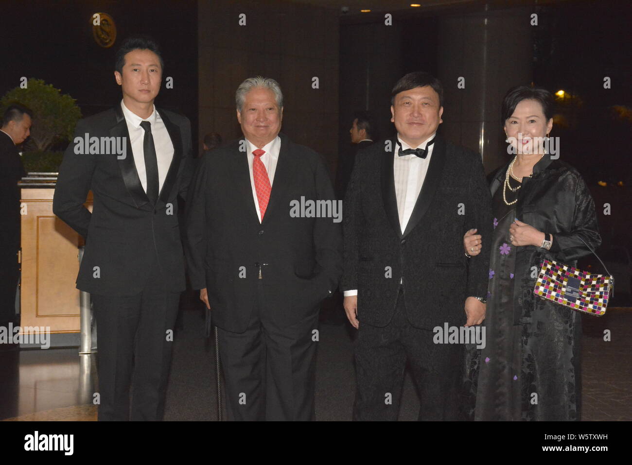Hong Kong actor and martial artist Sammo Hung, second left, and film ...