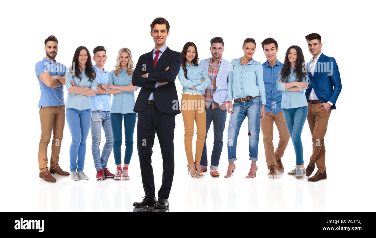 confident group leader standing on white background with hands folded ...