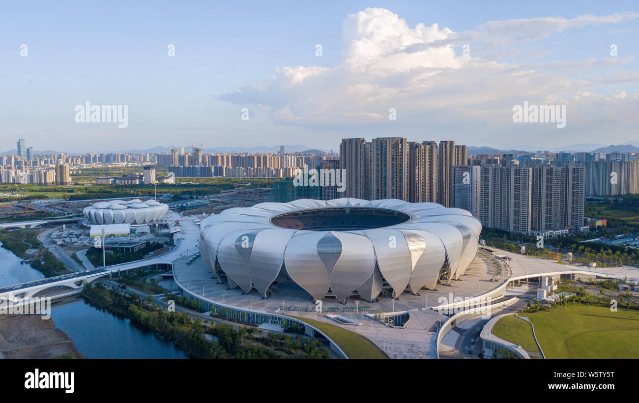 The main stadium of the Hangzhou Olympic Sports Center, resembling a ...
