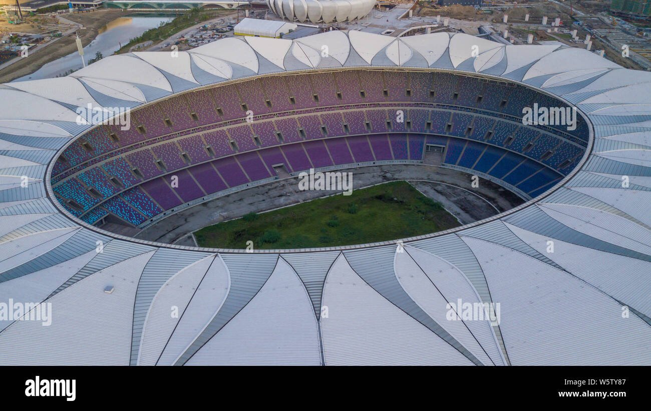 The main stadium of the Hangzhou Olympic Sports Center, resembling a ...