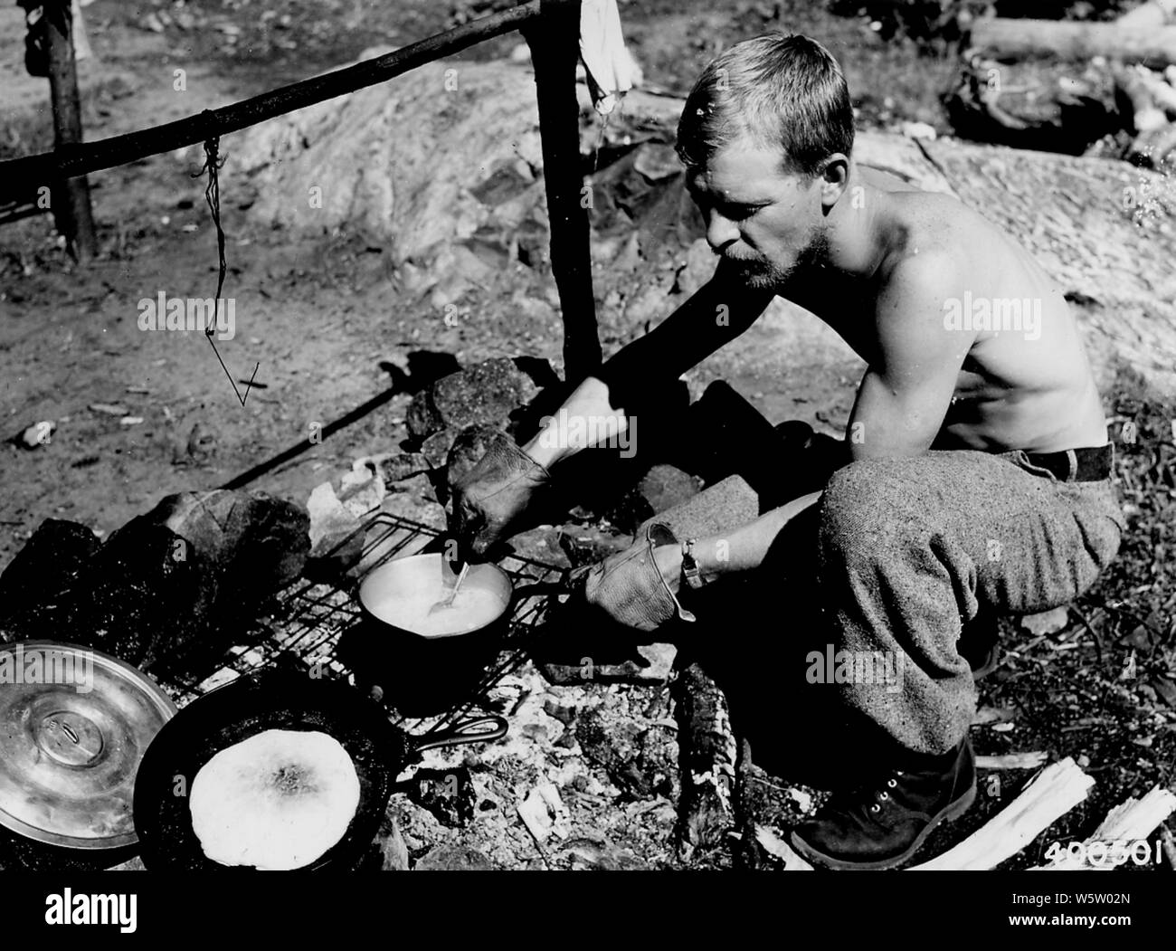 Photograph of Preparing Lunch at a Canoe Camp Site; Scope and content ...