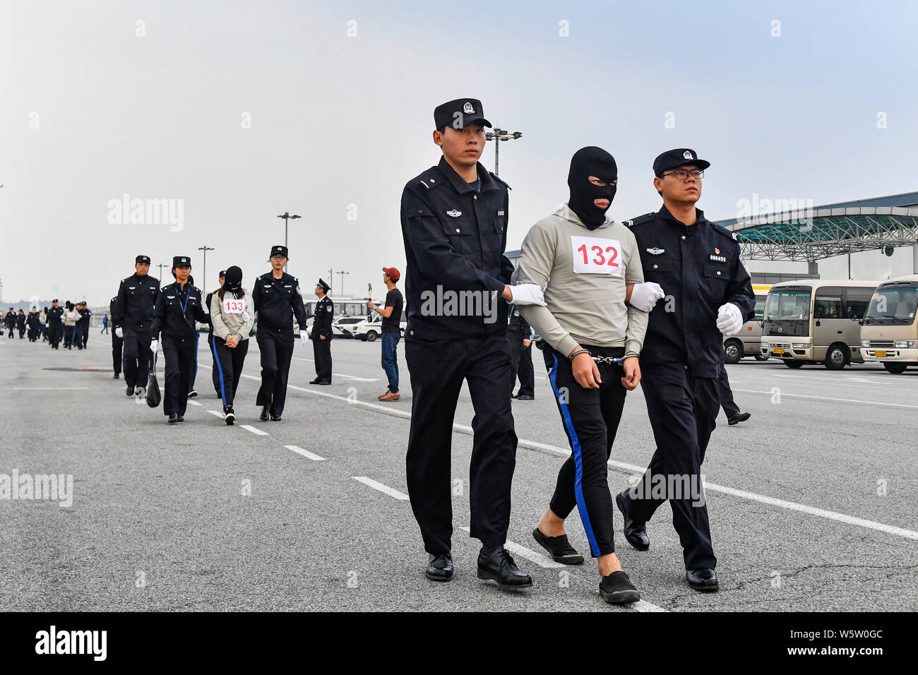 Chinese suspects arrested for cross-border telecom fraud are escorted ...