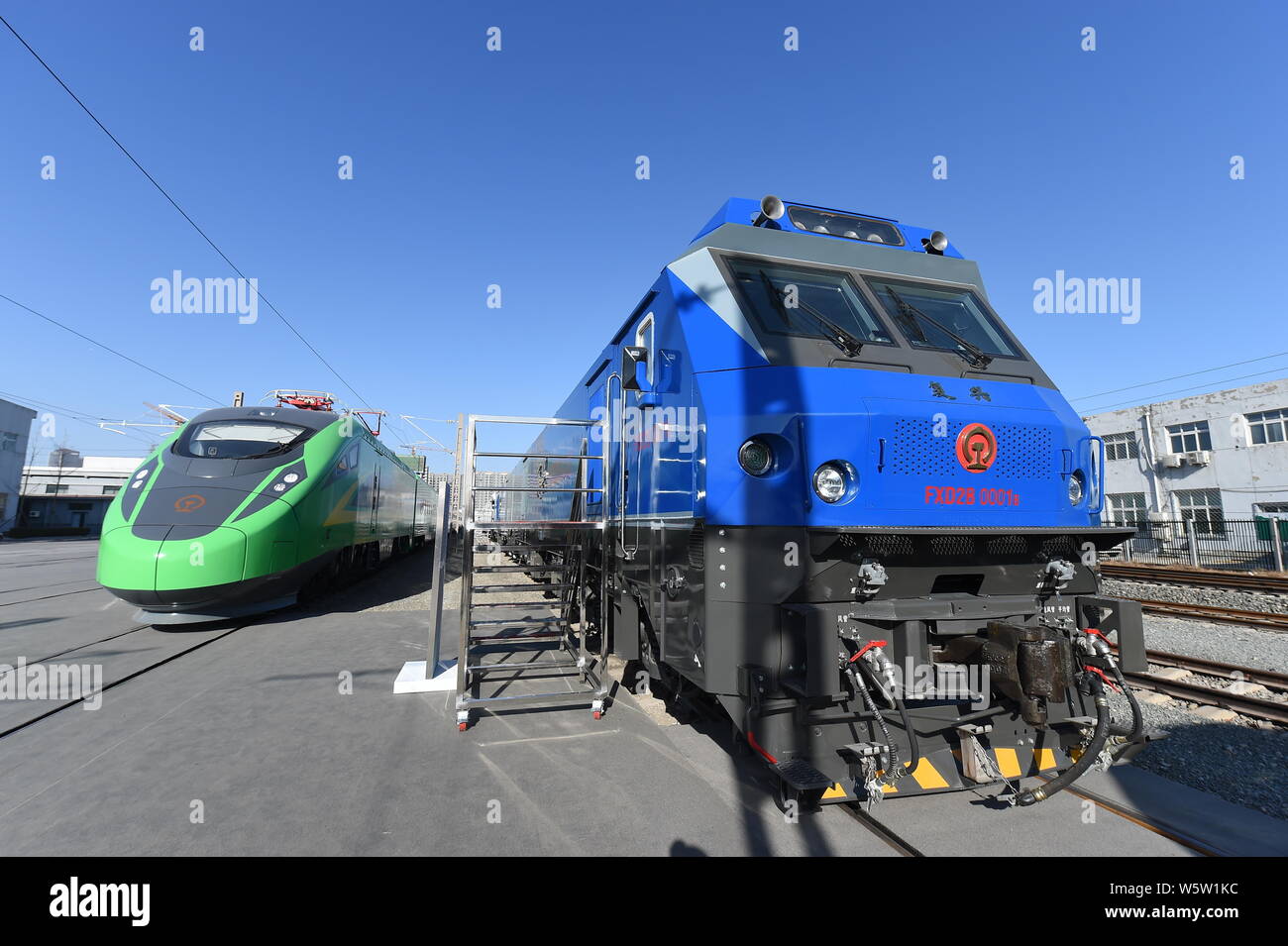The newly developed Fuxing bullet trains are shown at an exhibition in ...