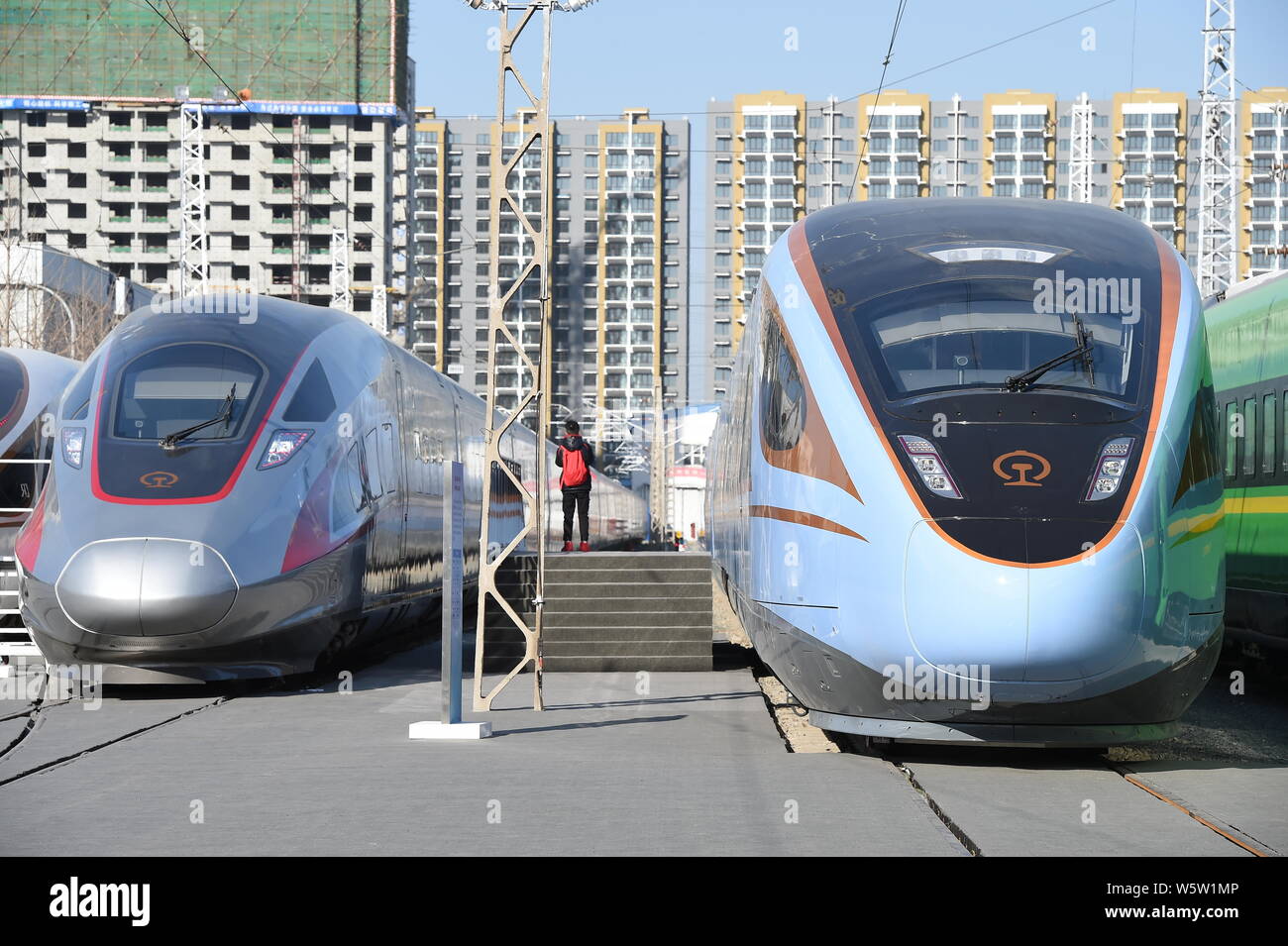The newly developed Fuxing bullet trains are shown at an exhibition in ...