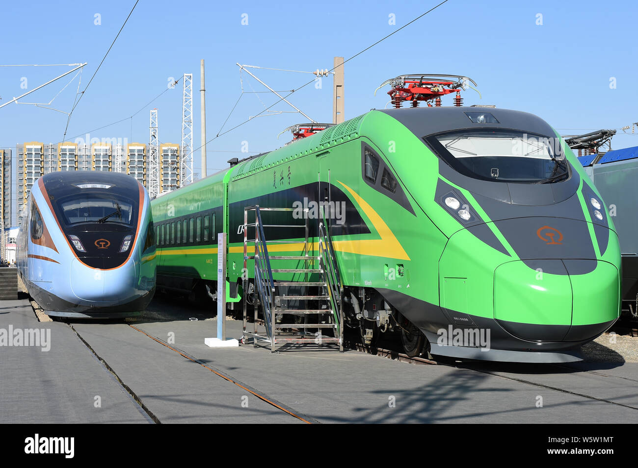The newly developed Fuxing bullet trains are shown at an exhibition in ...