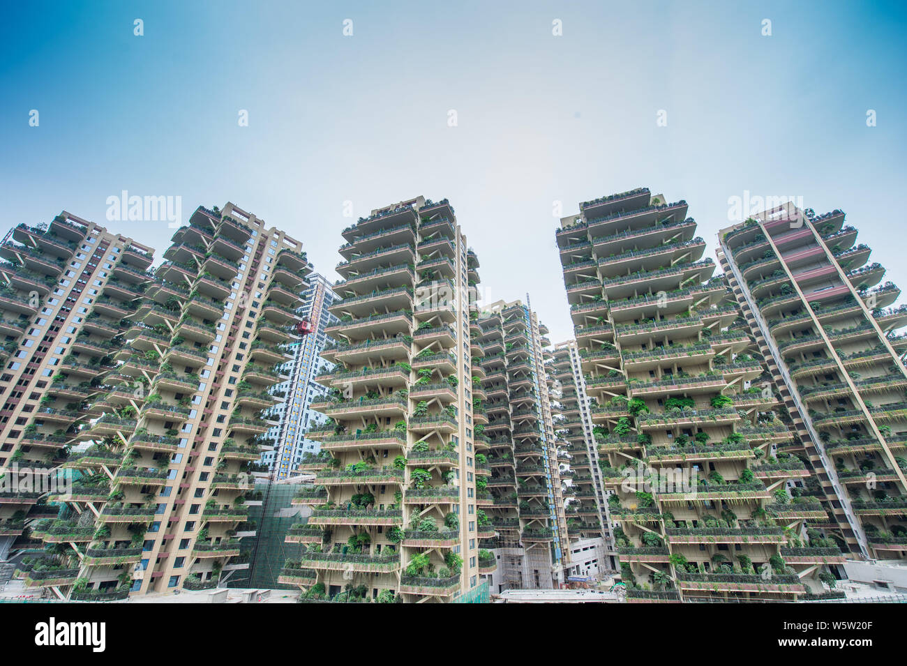 The balconies of newly-constructed residential buildings are decorated ...