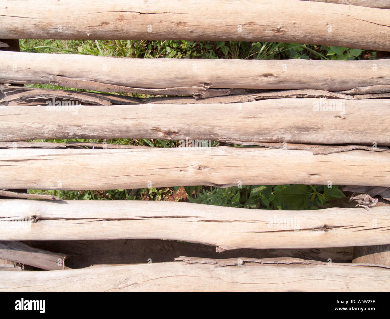 Timber wall in the ground On a natural background Stock Photo - Alamy