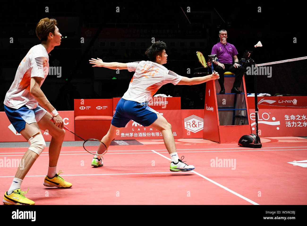 Li Junhui and Liu Yuchen of China return a shot to Hiroyuki Endo and ...
