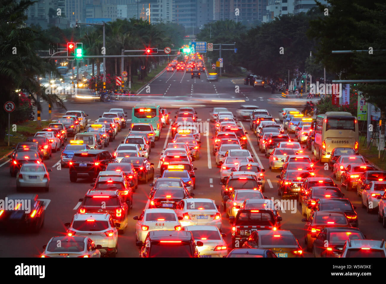 Masses of vehicles travel on the road during rush hours in Haikou city ...