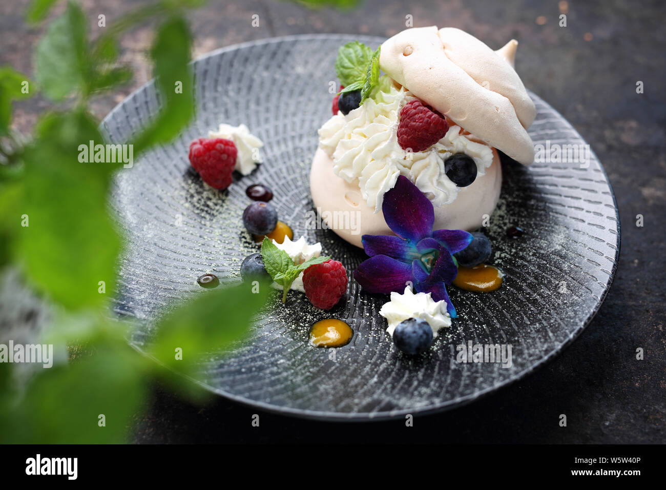 Meringue with cream and fruit. Sweet dessert Stock Photo - Alamy