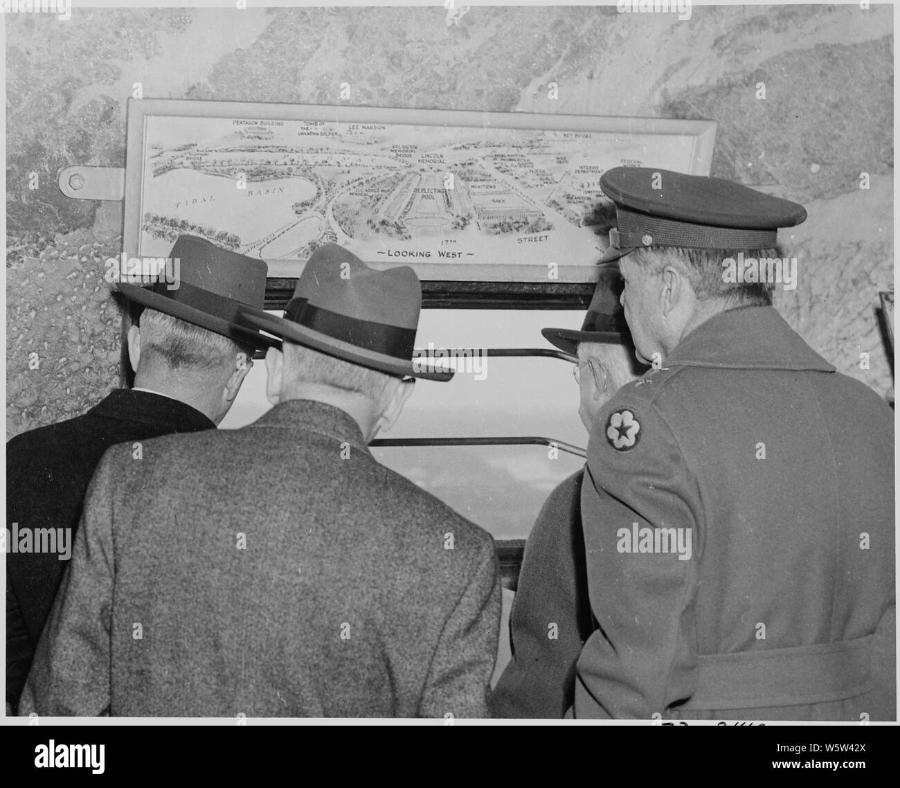 Photograph of President Truman and others with their backs turned to ...
