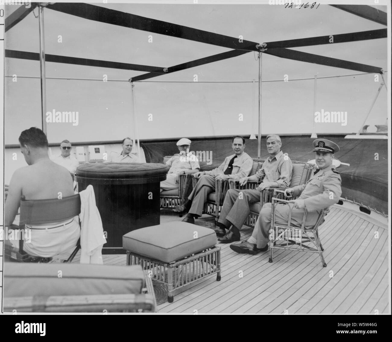 Photograph of President Truman and others relaxing on the after deck of ...