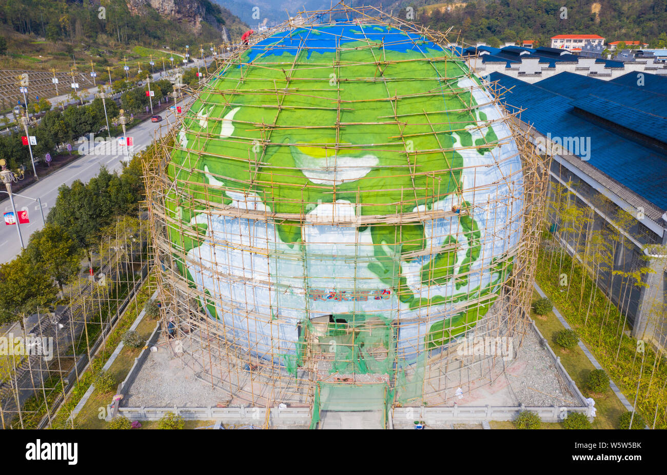 Aerial view of a newly-built construction featuring shape of a globe ...
