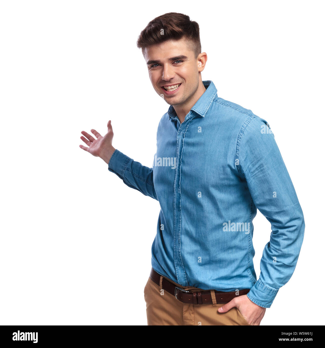 young happy casual man presenting something on white background Stock ...